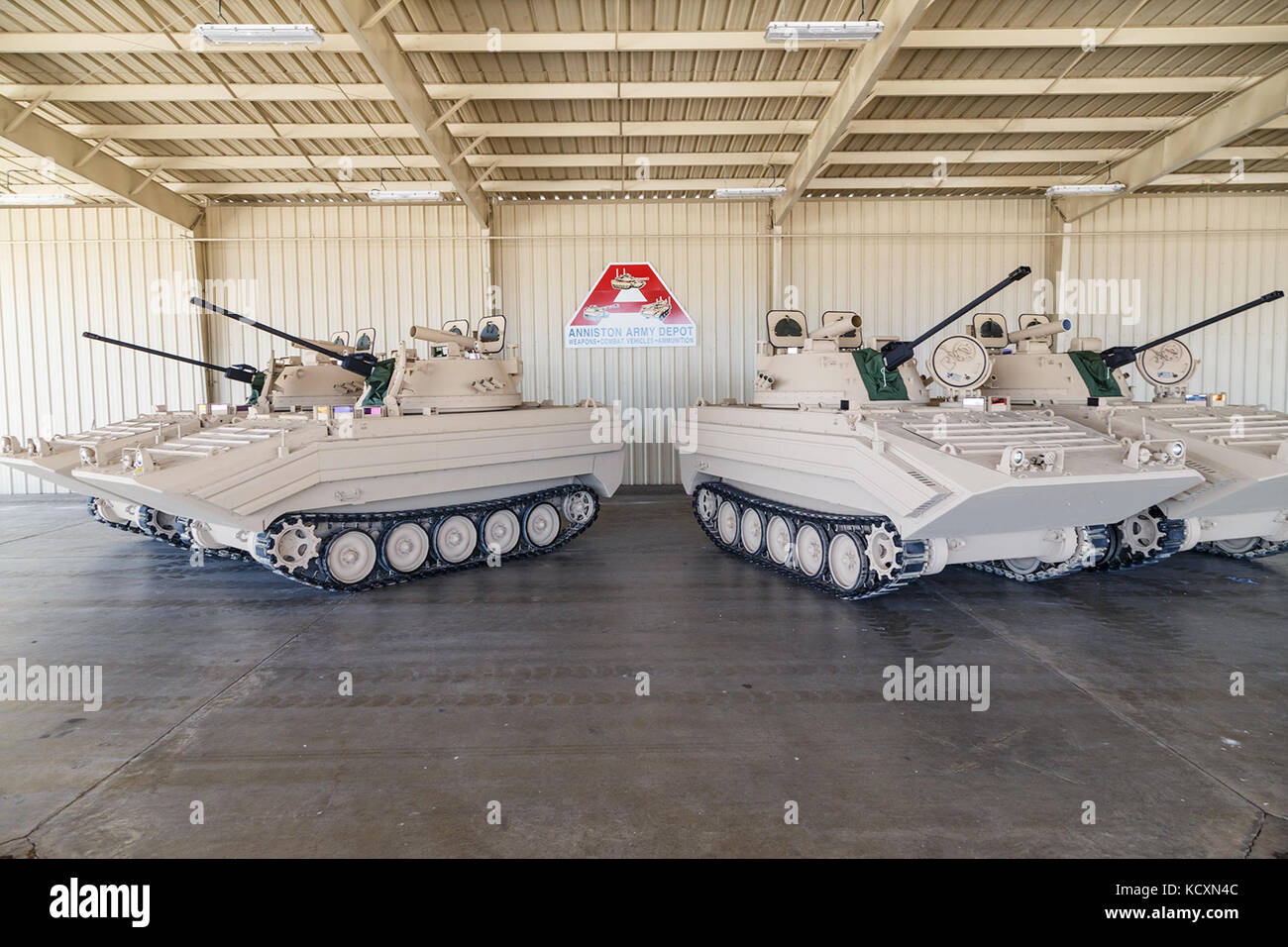 A line of M113A3/BMP-2 Opposing Forces Surrogate Vehicles stand ready ...