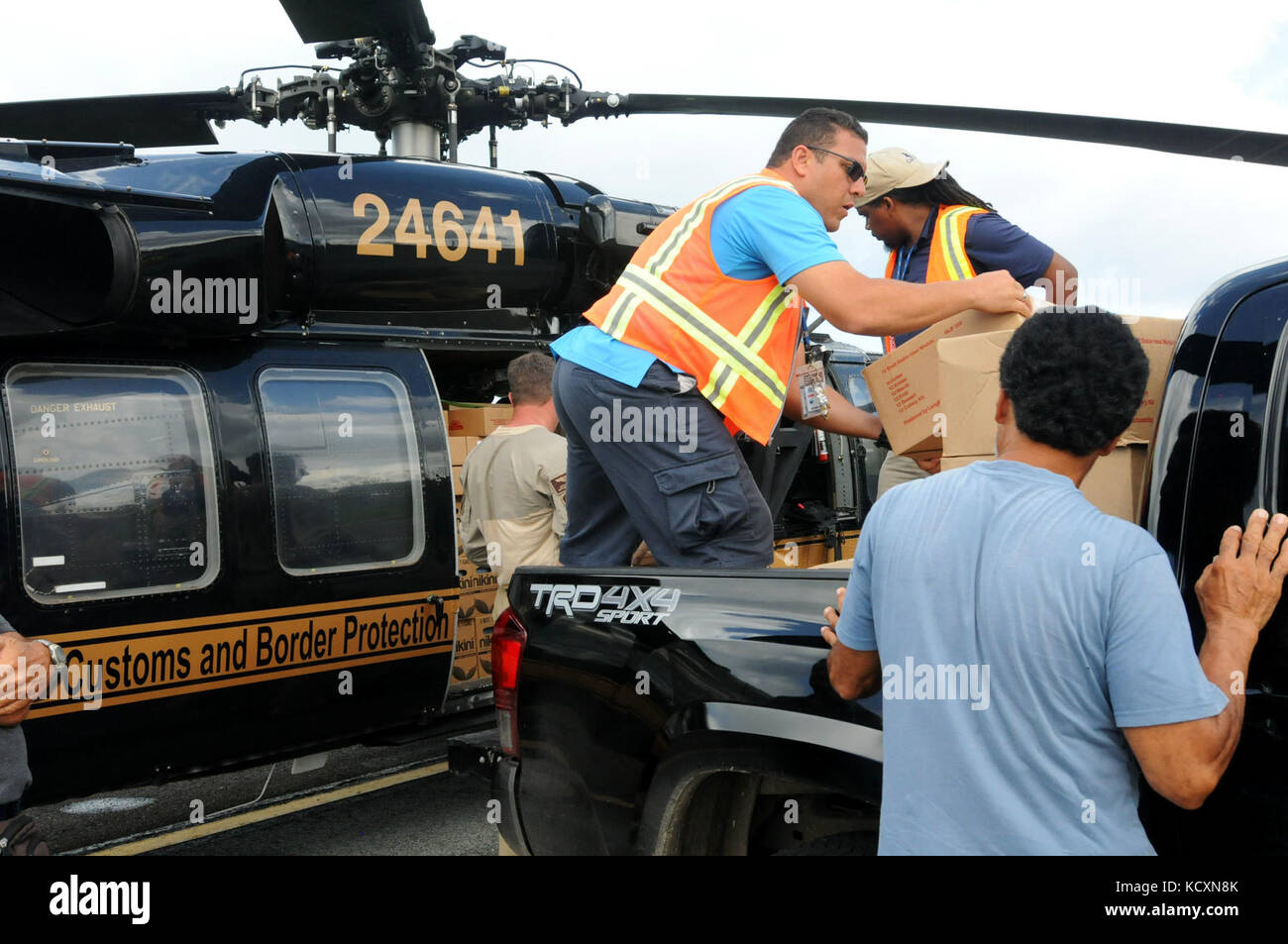 U.S. Customs and Border Protection crewmembers deliver water and food ...