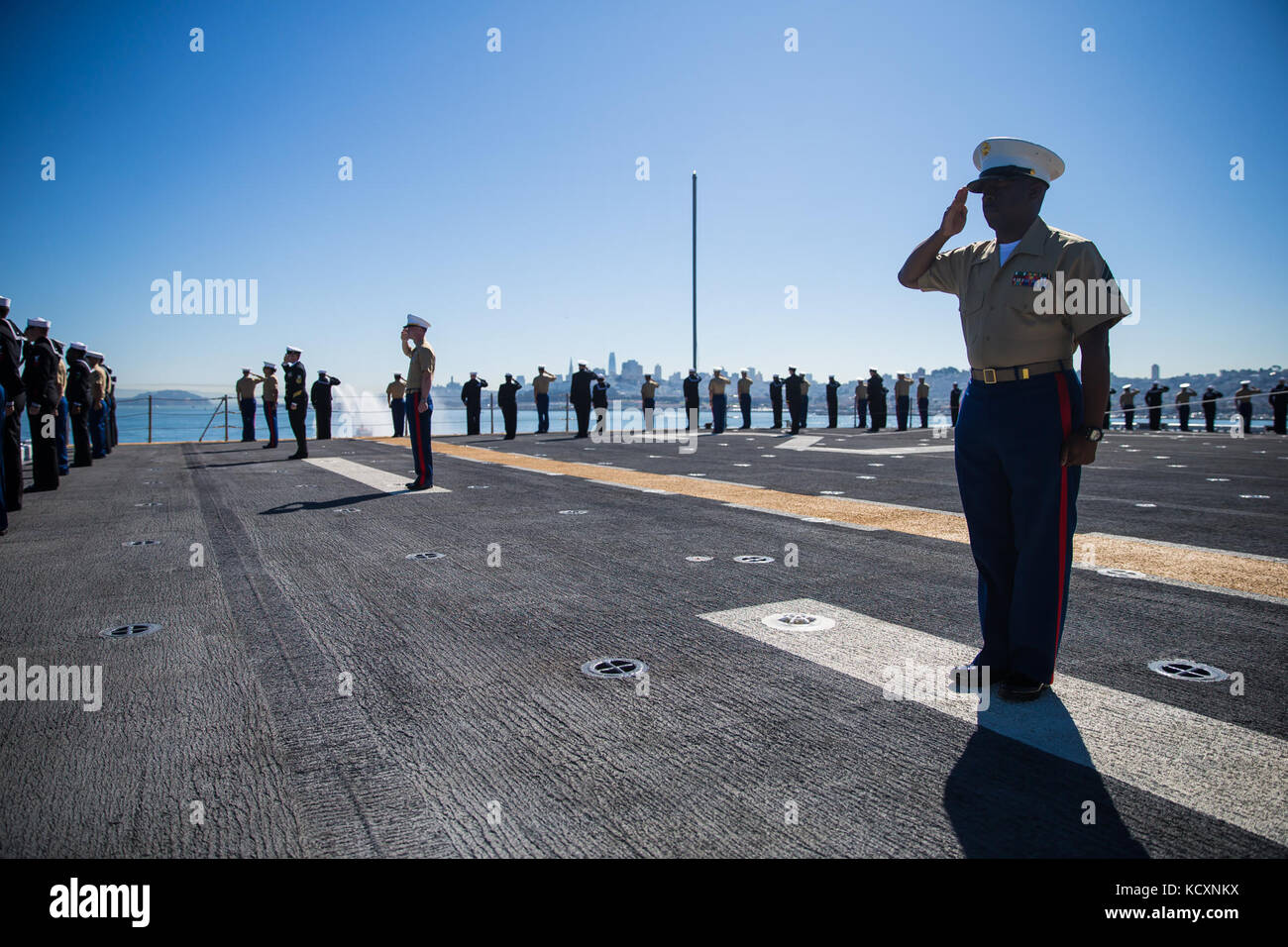 U.S. Marines and Navy Sailors “Man the Rails” aboard the USS Essex LHD2 ...