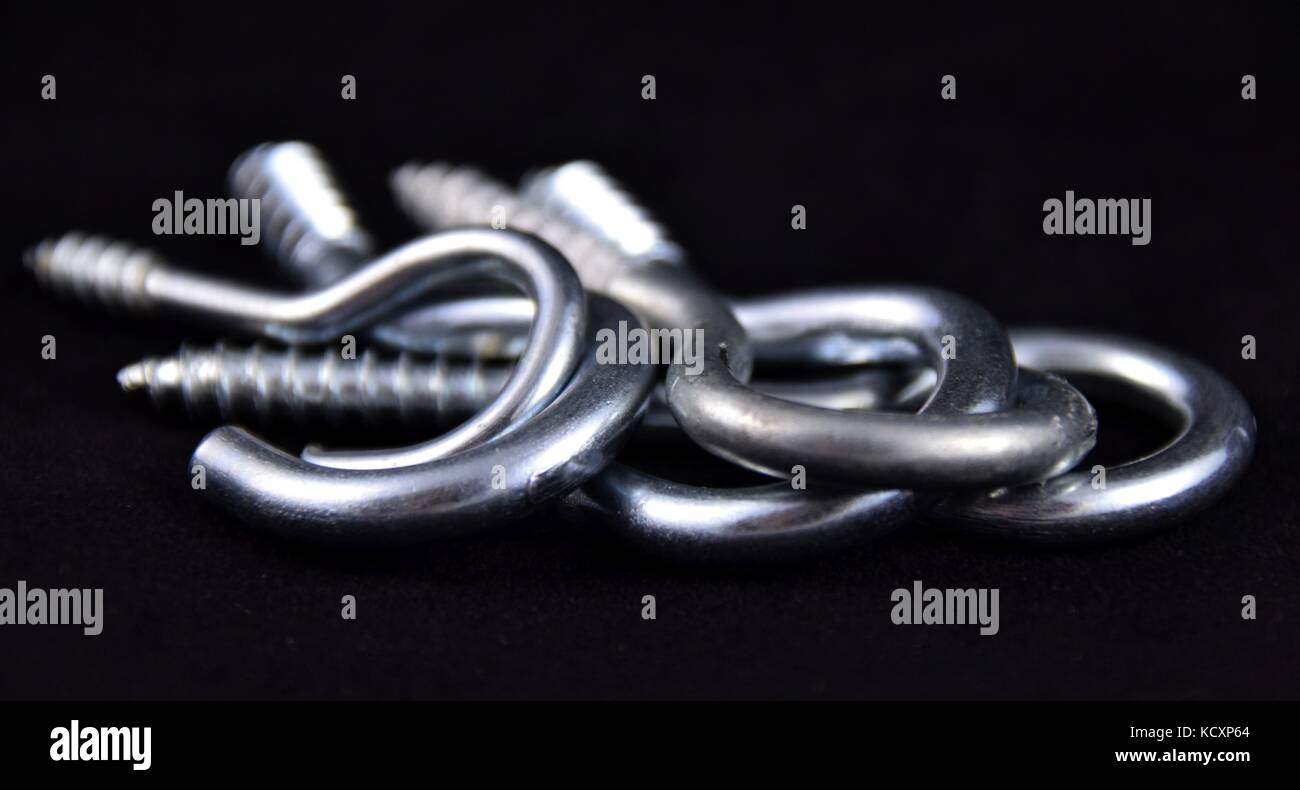 stainless steel hook with conical thread, a group of abstract metal ...