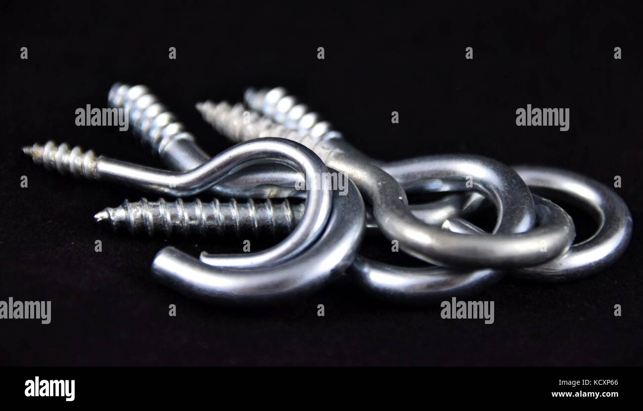 stainless steel hook with conical thread, a group of abstract metal ...