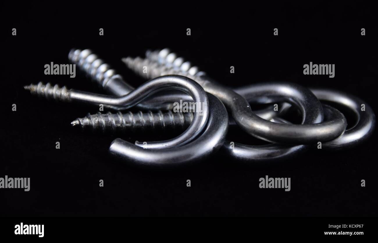 stainless steel hook with conical thread, a group of abstract metal ...