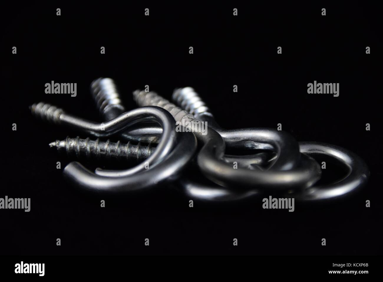 stainless steel hook with conical thread, a group of abstract metal ...