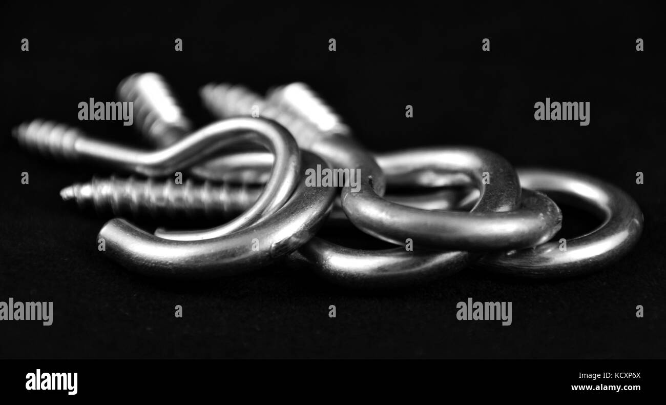 stainless steel hook with conical thread, a group of abstract metal ...