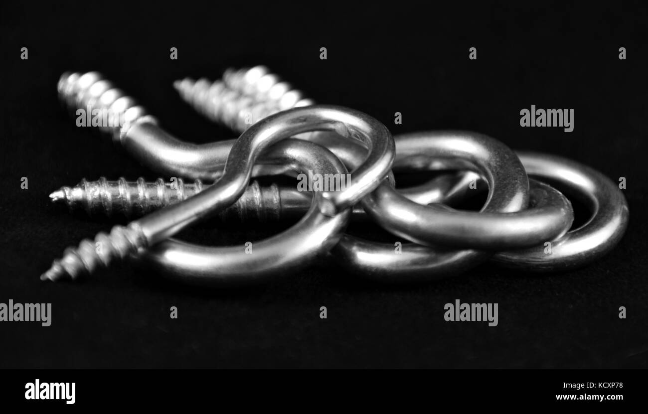 stainless steel hook with conical thread, a group of abstract metal ...