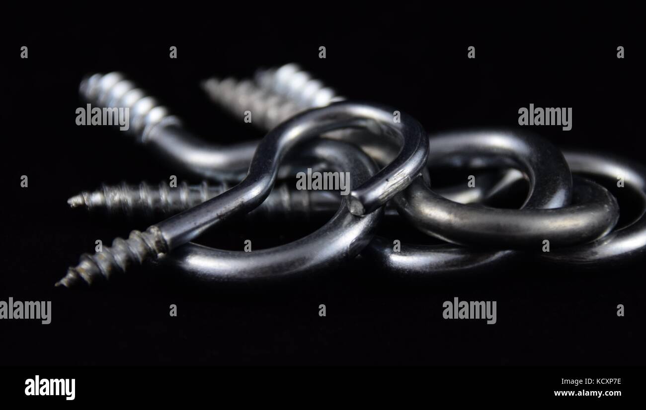 stainless steel hook with conical thread, a group of abstract metal ...