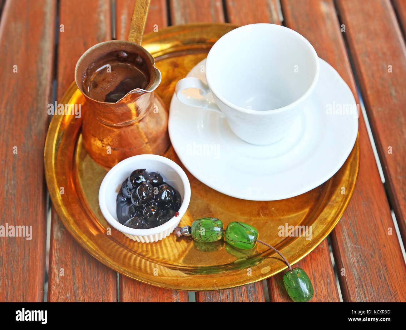 traditional greek coffee with coffee pot, sweet cherry and rosary Stock ...