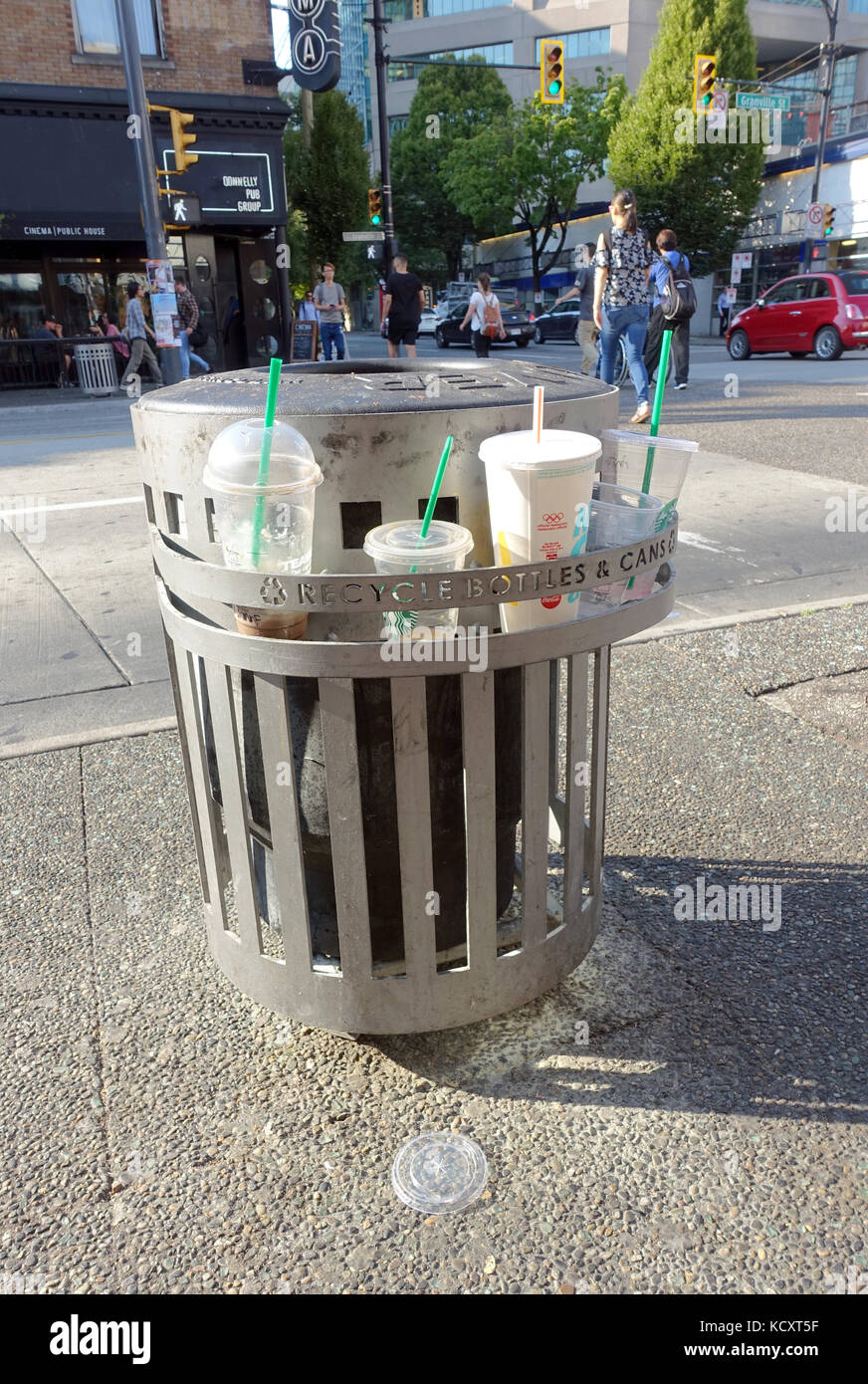 Different kinds of one-way cups can be seen in the intended holder of a ...