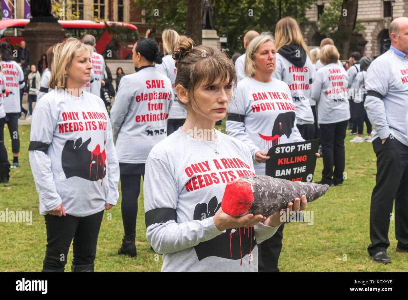 London, UK. 7th October 2017. A woman holds a mock rhino horn in the ...