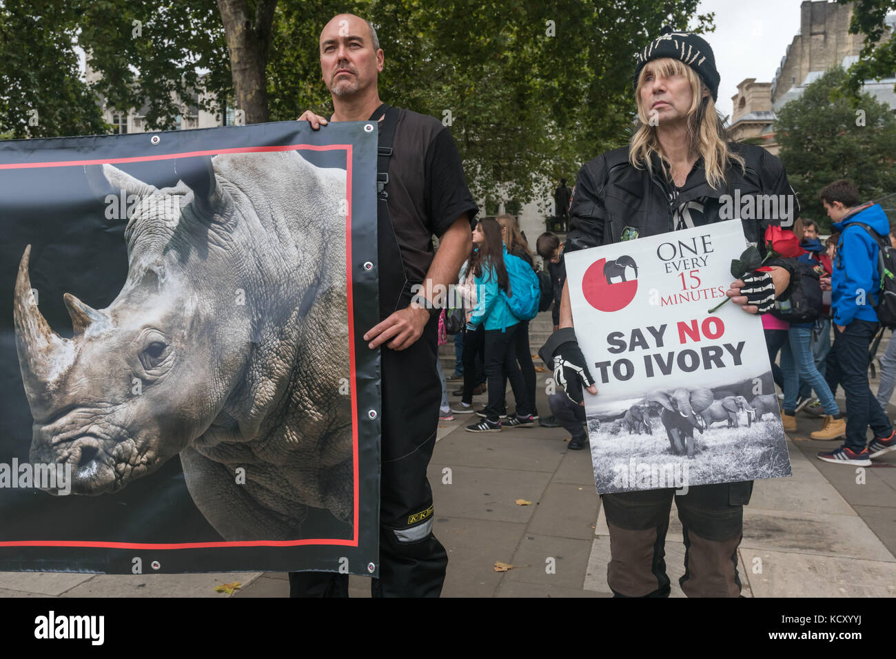 London, UK. 7th October 2017. People hold posters and banners against ...