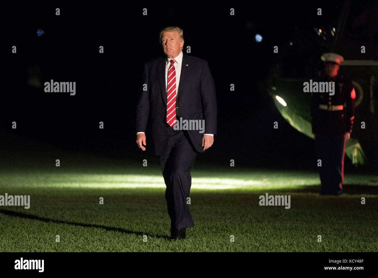 US President Donald J. Trump walks to the residence after stepping off ...