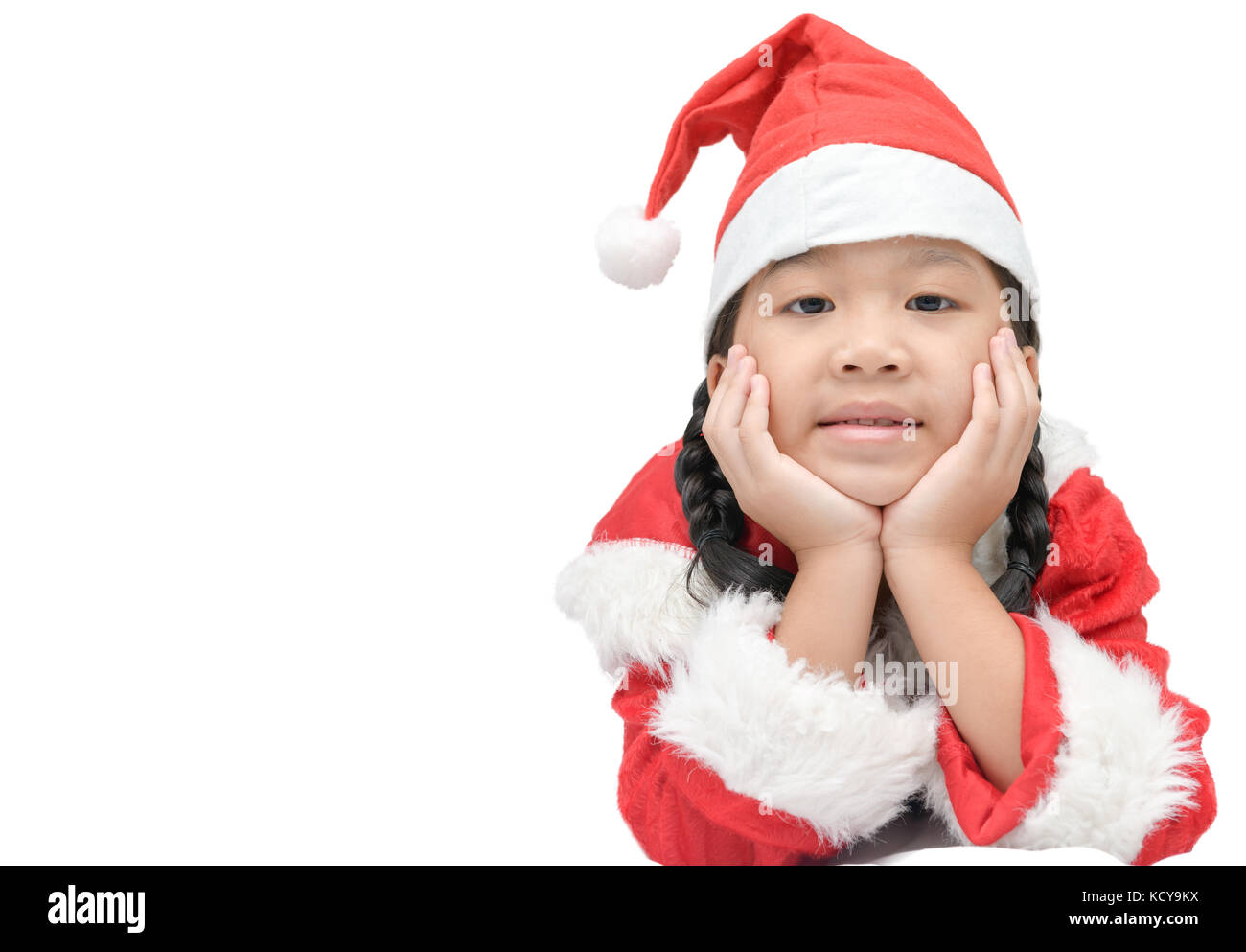 cute little asian girl in red santa hat isolated on white background ...