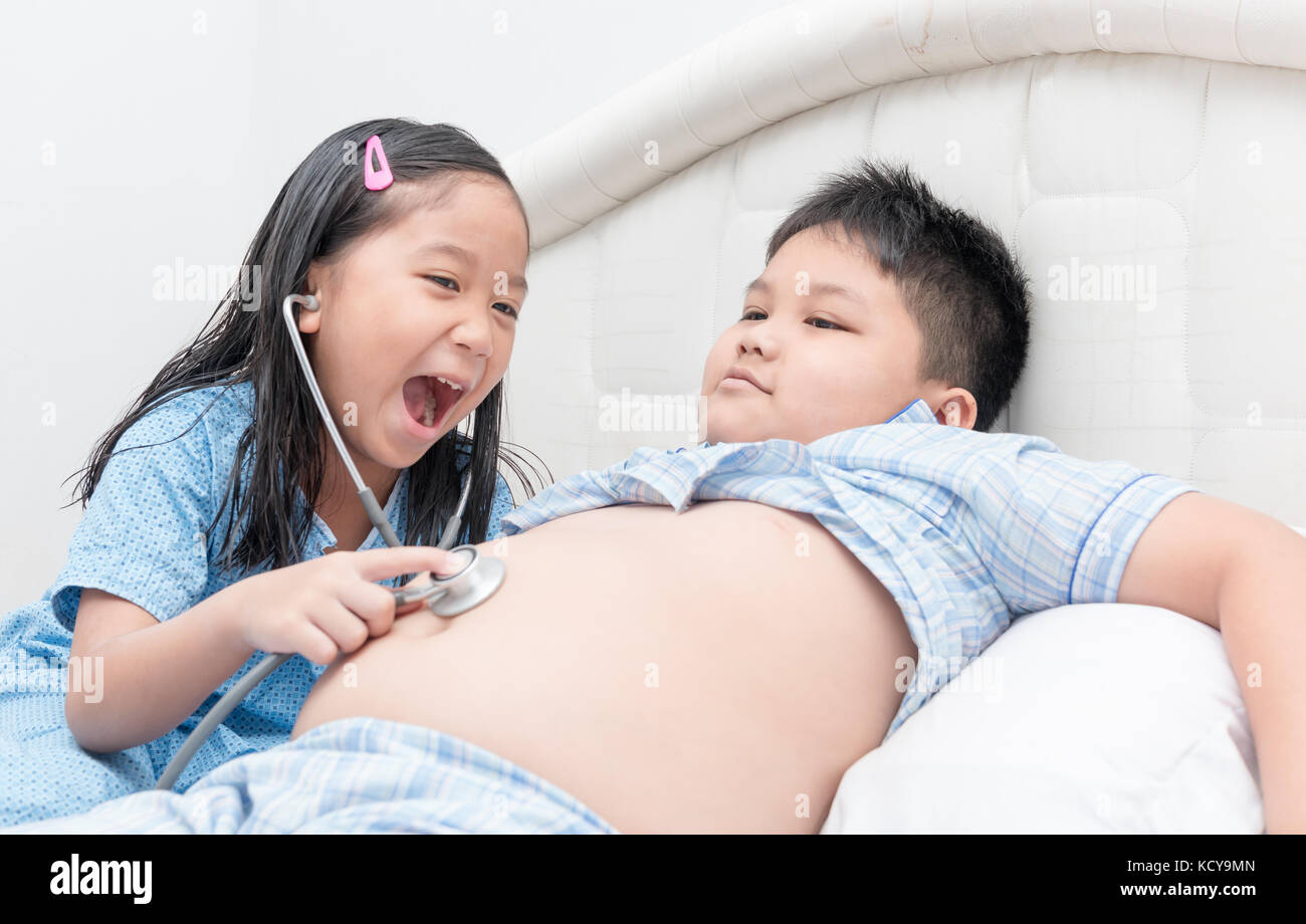 Brother sister playing doctor stethoscope hi-res stock photography and ...