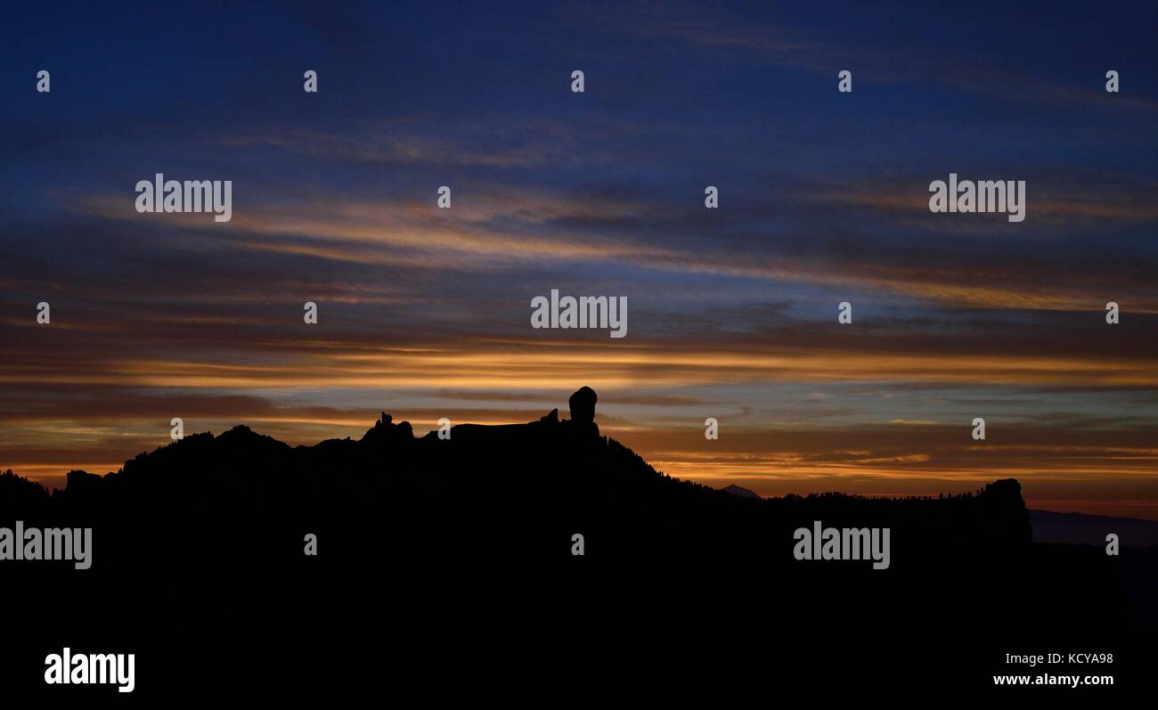 Awesome sunset with sky of intense colors, Roque Nublo, summit of Gran ...