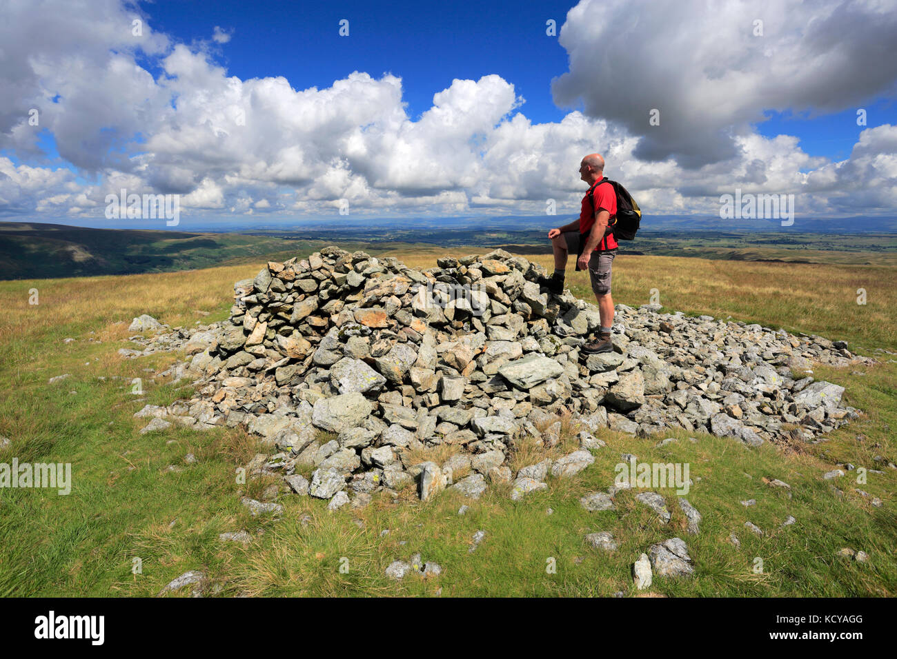 Walker at the summit of Selside fell, Lake District National Park ...
