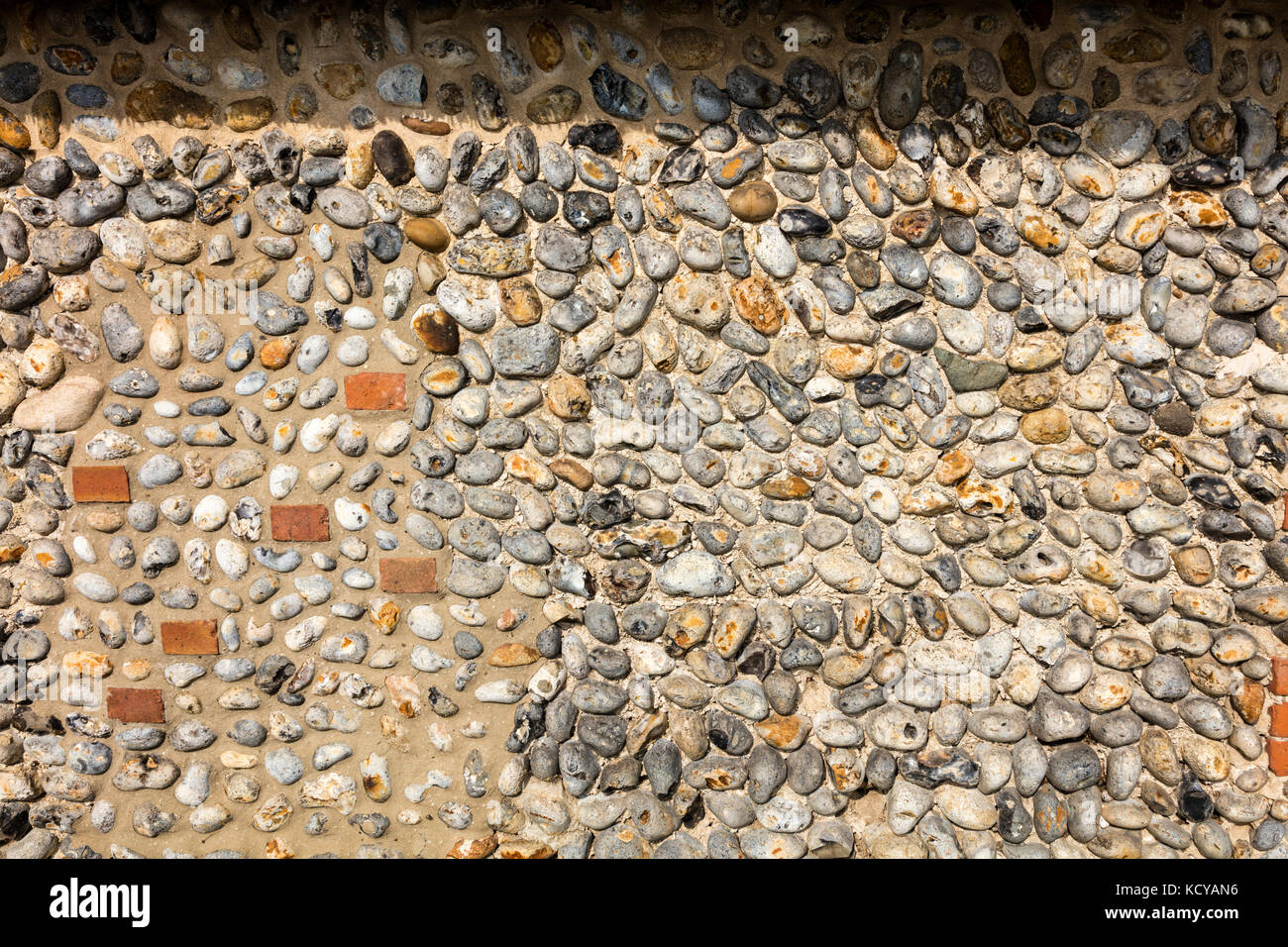 Flint and brick wall on a historic barn in Horsey, Norfolk, UK Stock ...