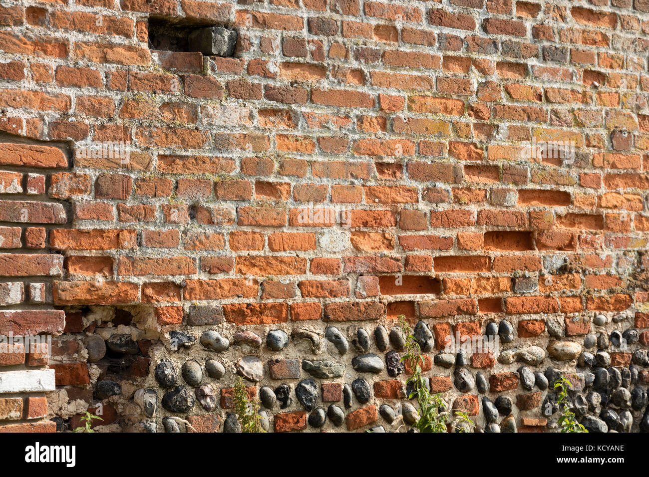 Historic flint and red brick barn wall at Horsey, Norfolk, UK Stock ...