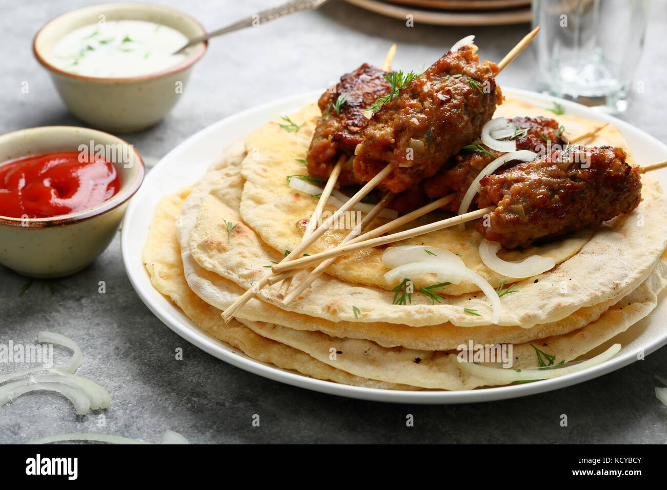 Turkish beef kebab on bread, food closeup Stock Photo - Alamy