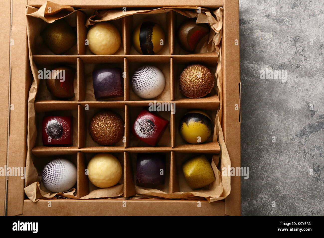 Small box with chocolate candies, food above Stock Photo - Alamy