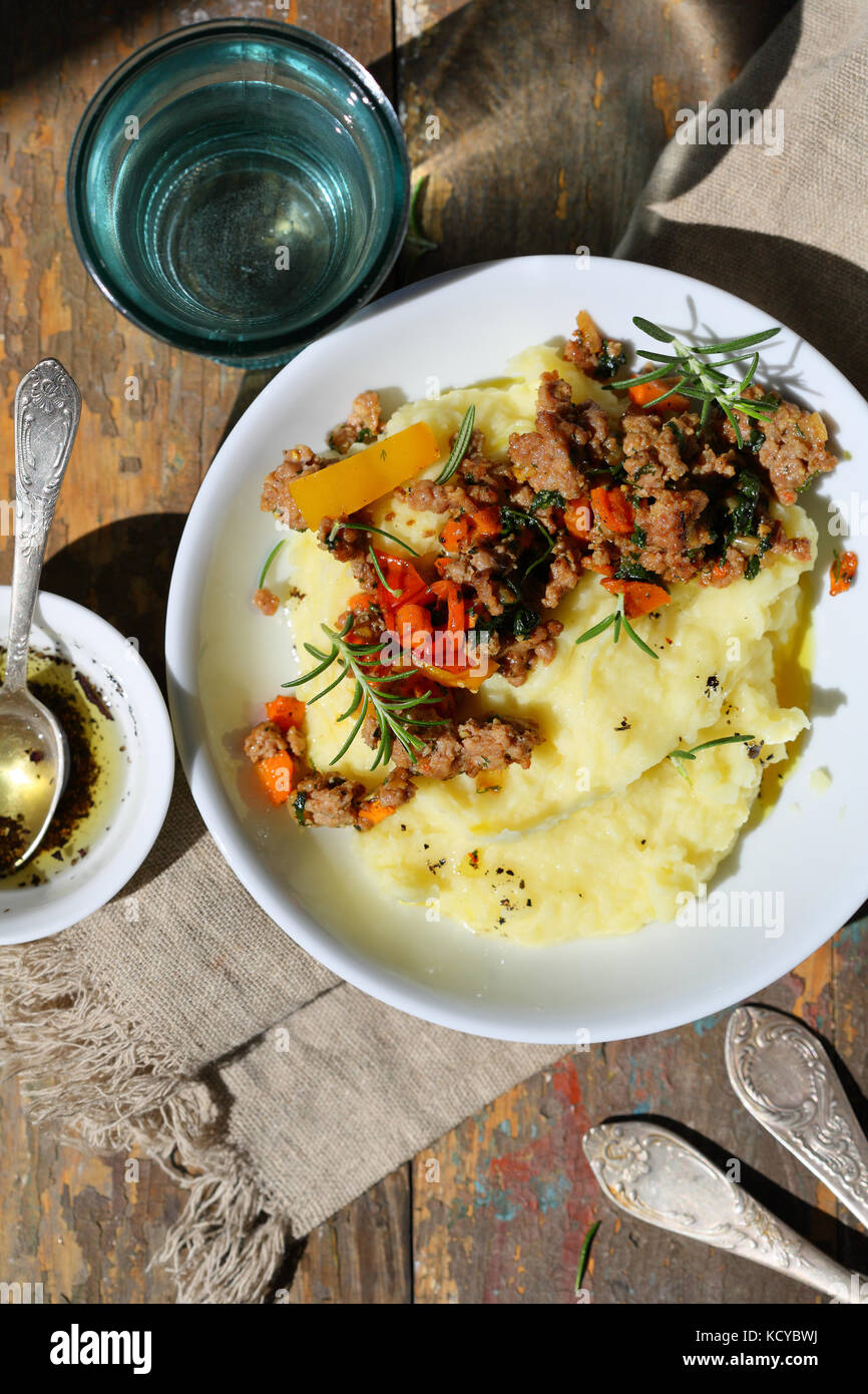 Potato garnish with meat sauce, food above Stock Photo - Alamy