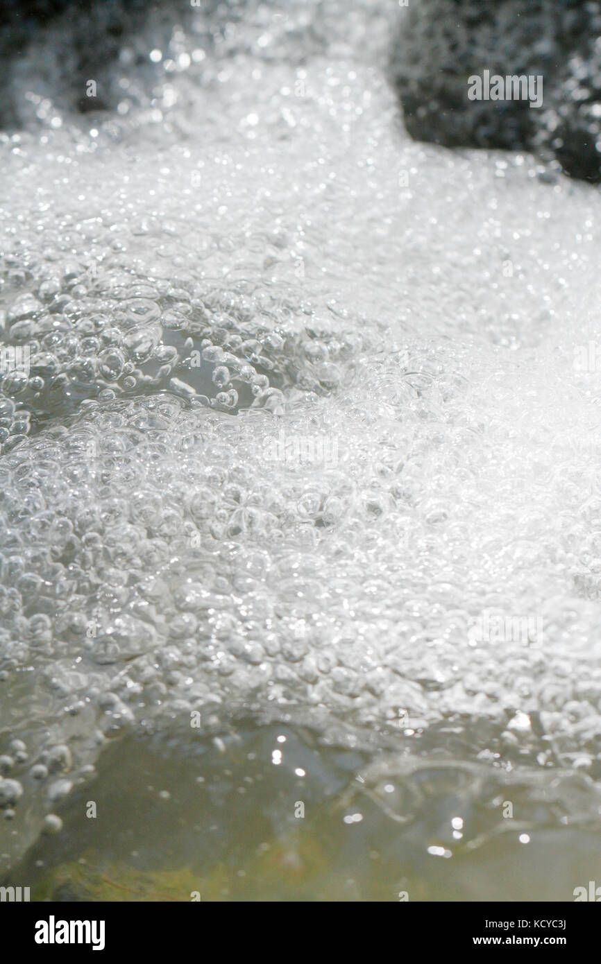 WATER TORRENT IN WATERFALL BREAKING IN THE ROCKS Stock Photo - Alamy