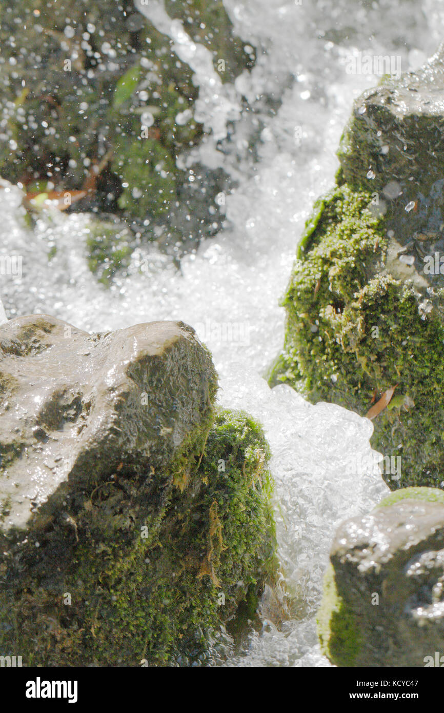 WATER TORRENT IN WATERFALL BREAKING IN THE ROCKS Stock Photo - Alamy
