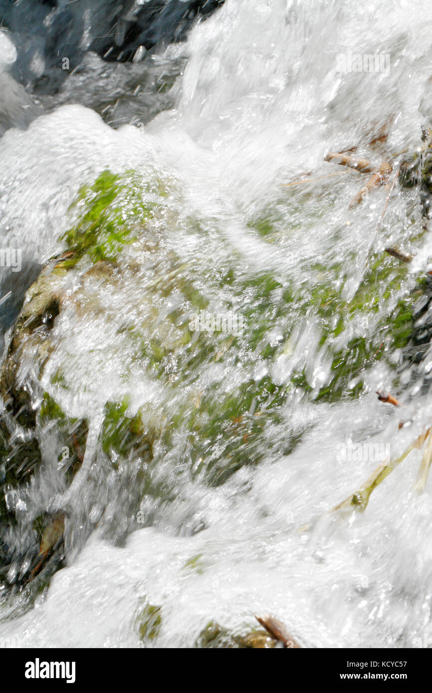 WATER TORRENT IN WATERFALL BREAKING IN THE ROCKS Stock Photo - Alamy