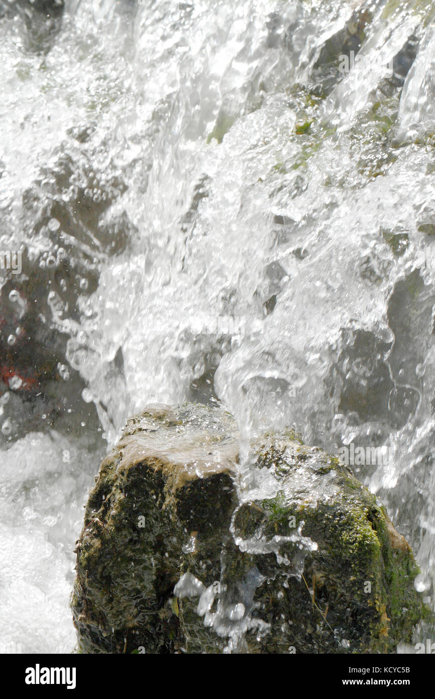 WATER TORRENT IN WATERFALL BREAKING IN THE ROCKS Stock Photo - Alamy