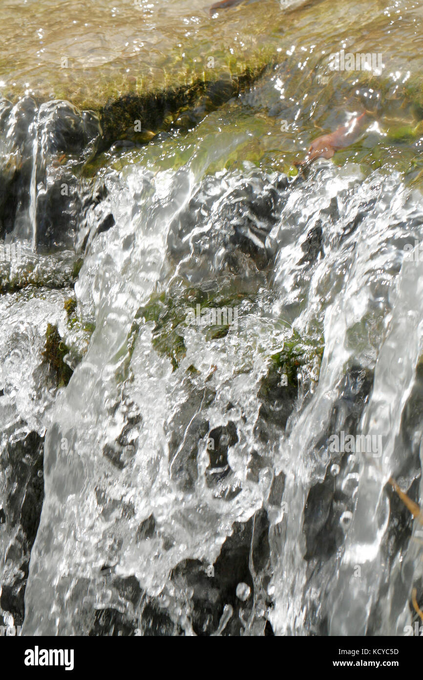 WATER TORRENT IN WATERFALL BREAKING IN THE ROCKS Stock Photo - Alamy