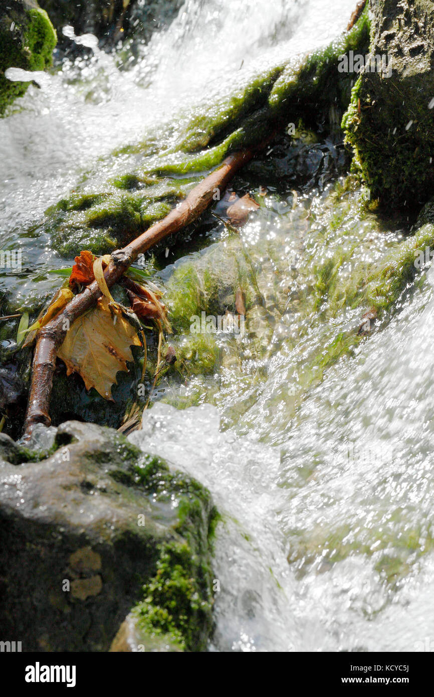 WATER TORRENT IN WATERFALL BREAKING IN THE ROCKS Stock Photo - Alamy
