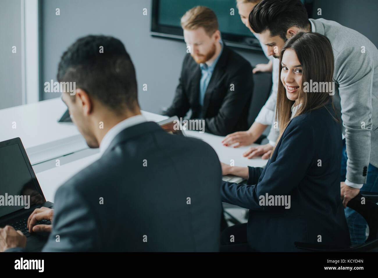 Business team working together in modern office to achieve better ...