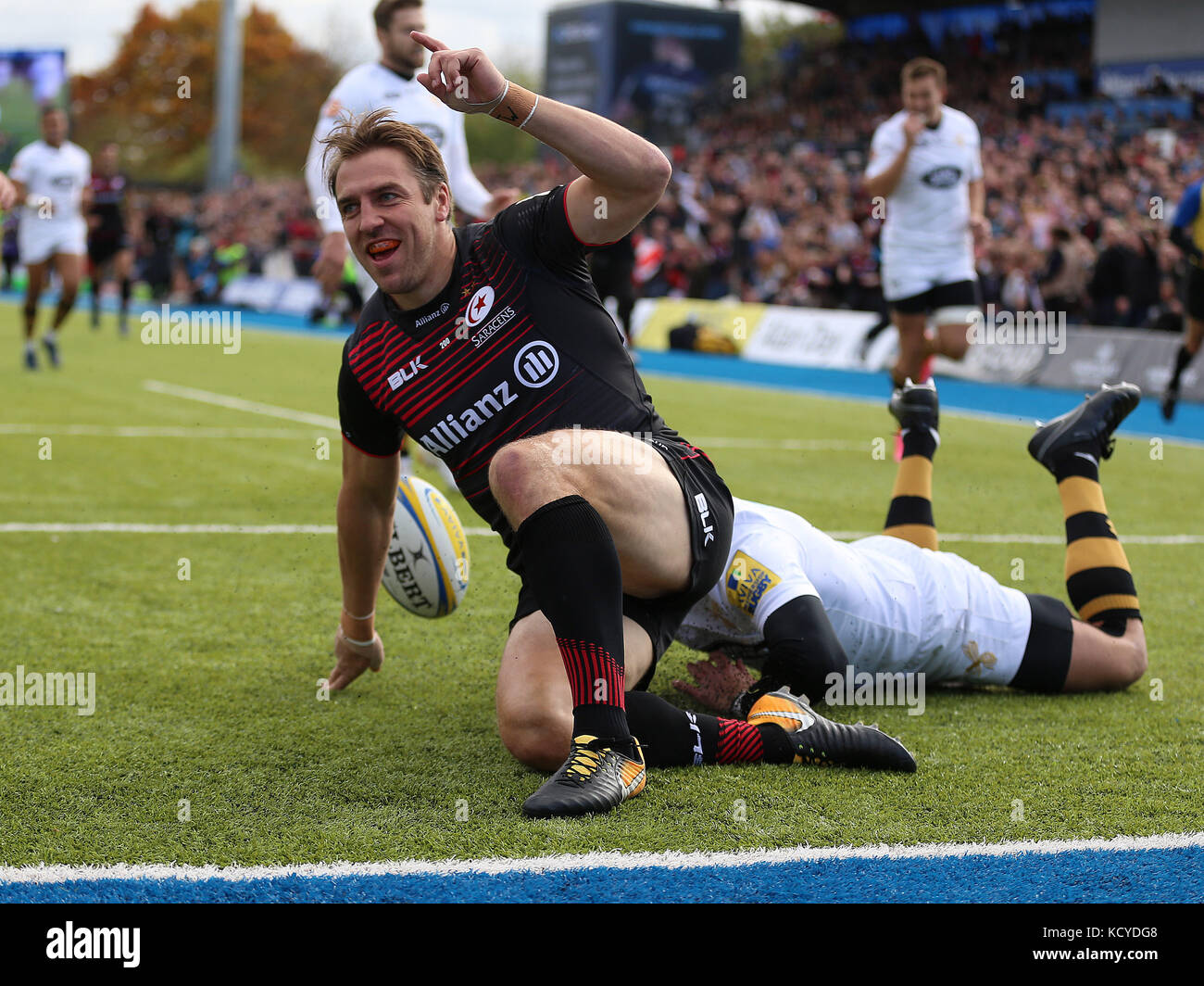 Saracens' Chris Wyles celebrates after scoring the opening try of the ...