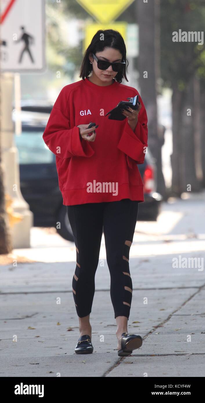 Vanessa Hudgens busy on her cell phone as she arrives for her pilates ...