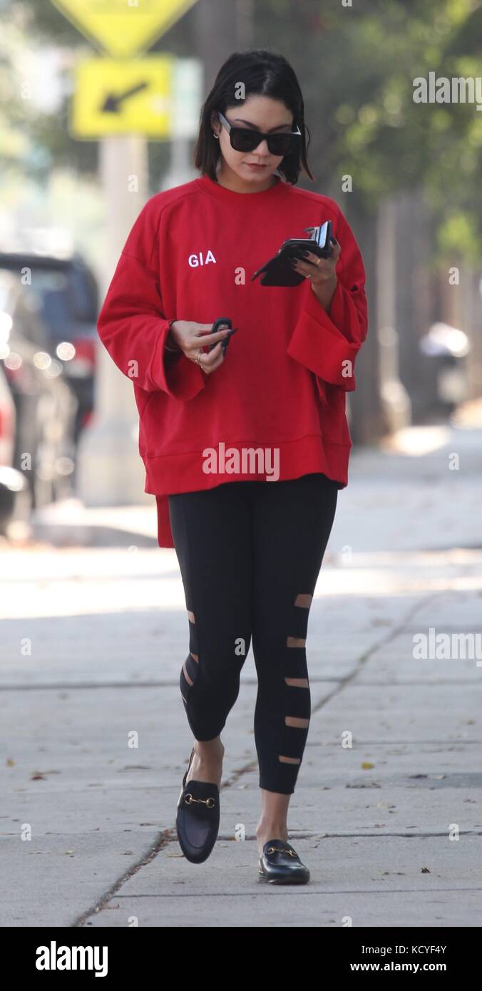 Vanessa Hudgens busy on her cell phone as she arrives for her pilates ...
