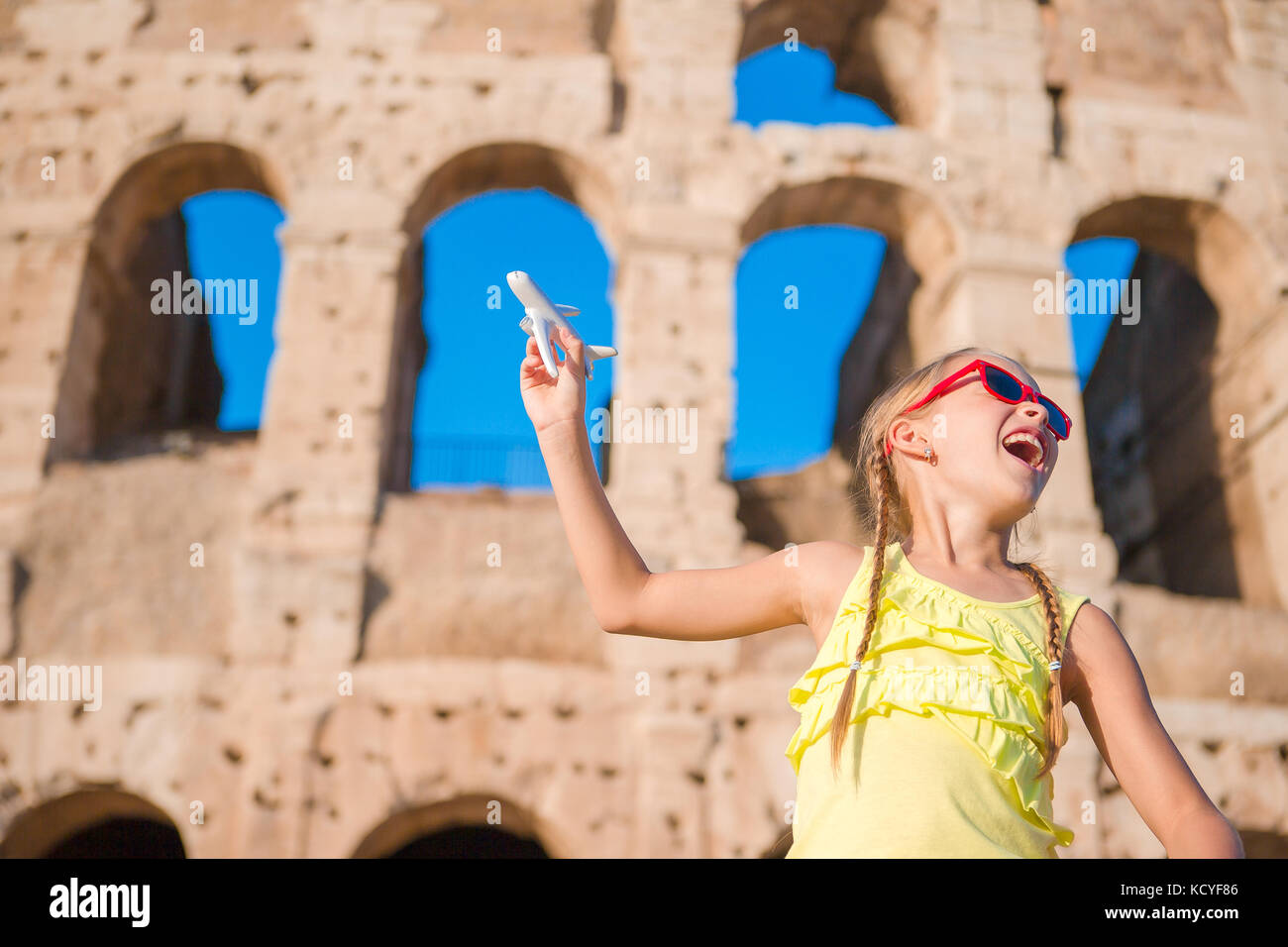 Young girl in front of colosseum in rome, italy Stock Photo - Alamy