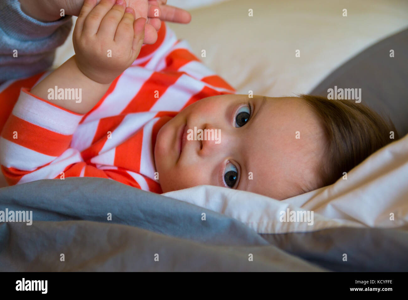 Portrait of cute baby boy with Down syndrome Stock Photo - Alamy
