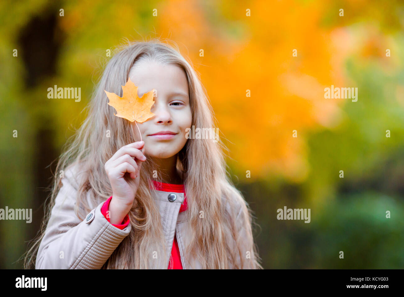Adorable little girl at beautiful autumn day outdoors Stock Photo - Alamy