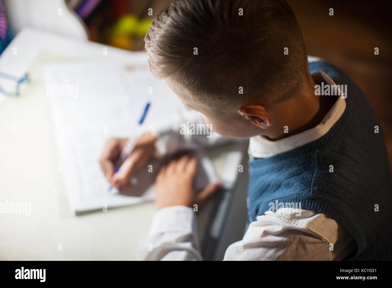 pupil boy does his homework Stock Photo - Alamy