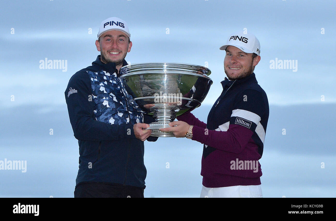 England's Tyrrell Hatton and Caddie Jonathan Bell pose with the trophy ...