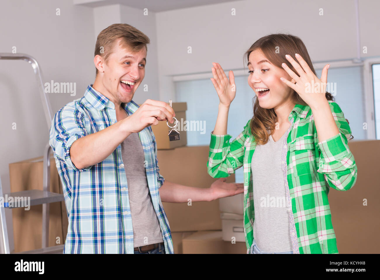 home, people, moving and real estate concept - Surprised woman looking ...