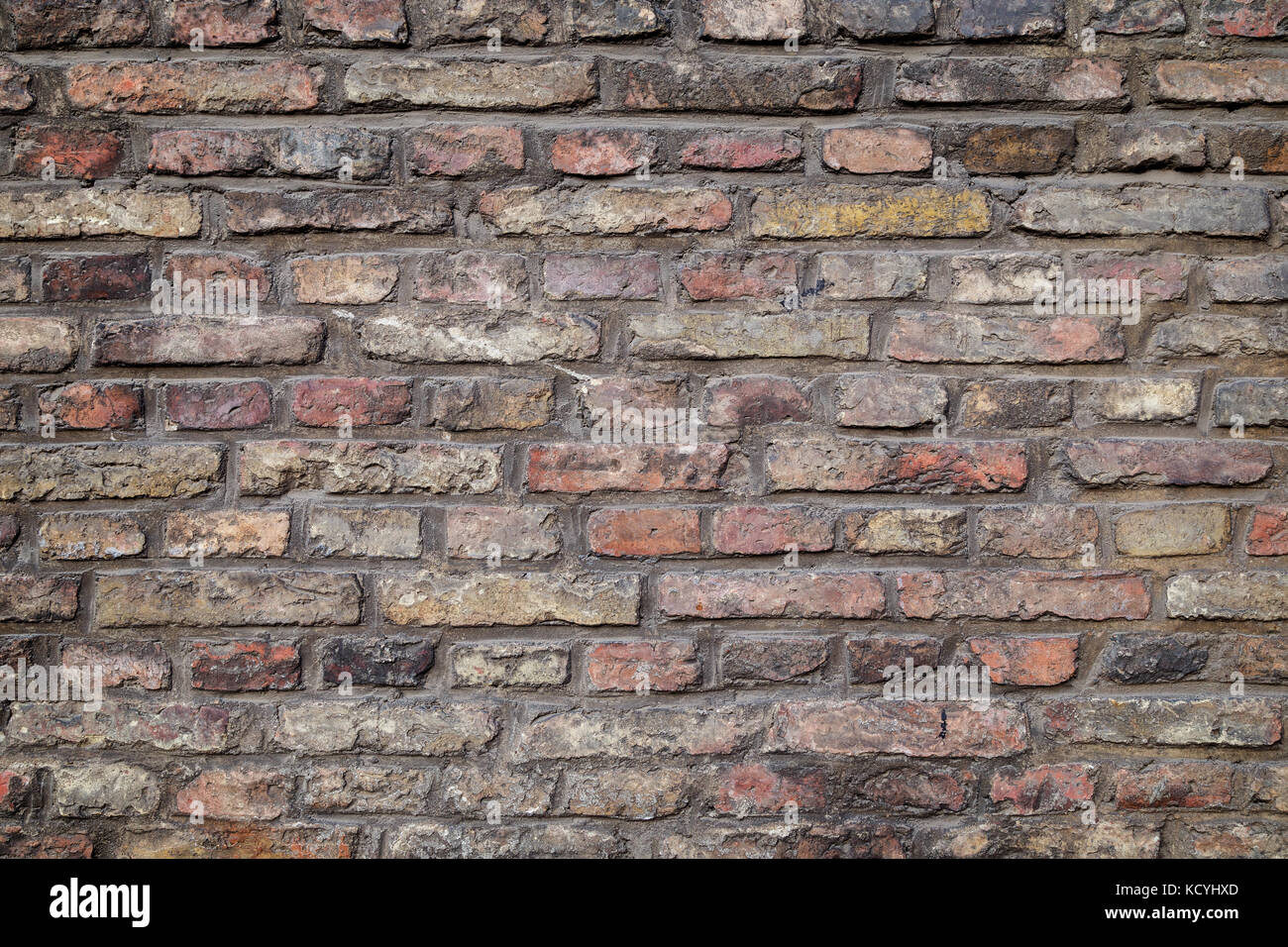 Close-up of an old and aged red brick wall texture background with ...