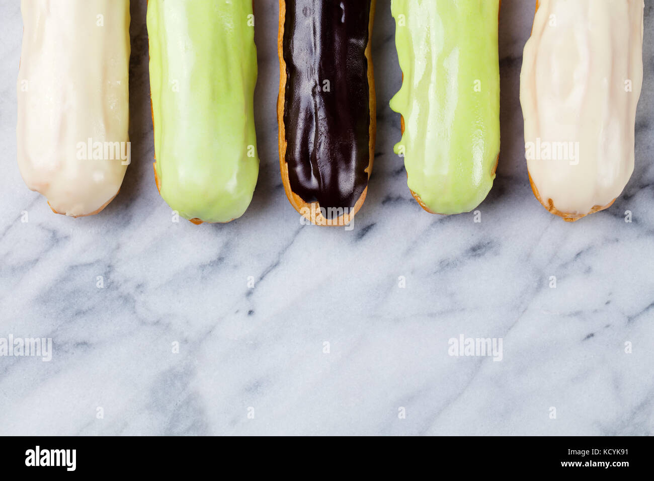 Eclairs traditional dessert Marble background. Copy space. Top view ...
