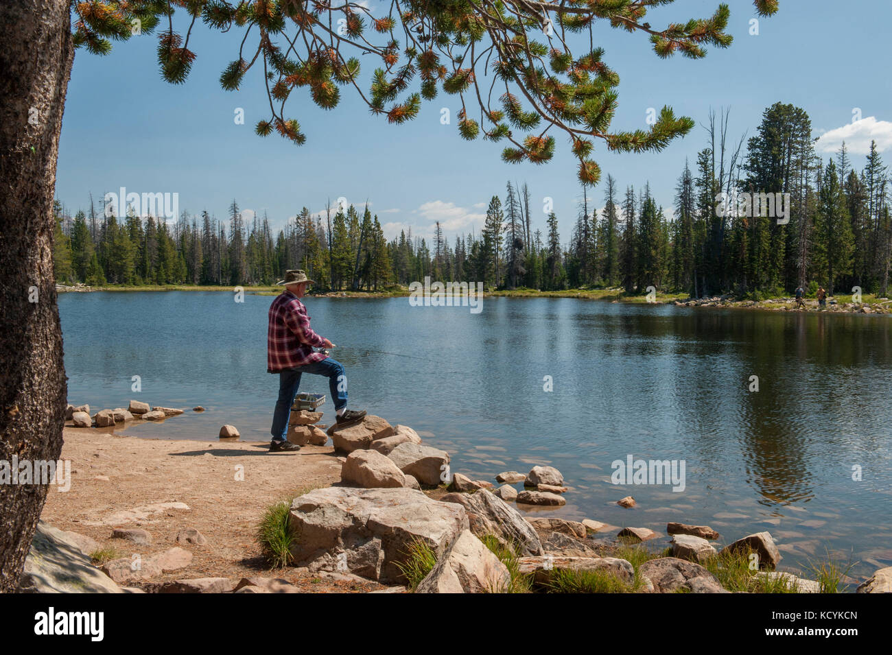 Fishermen fishing at Pass Lake alongside Utah's scenic Highway 150, in ...