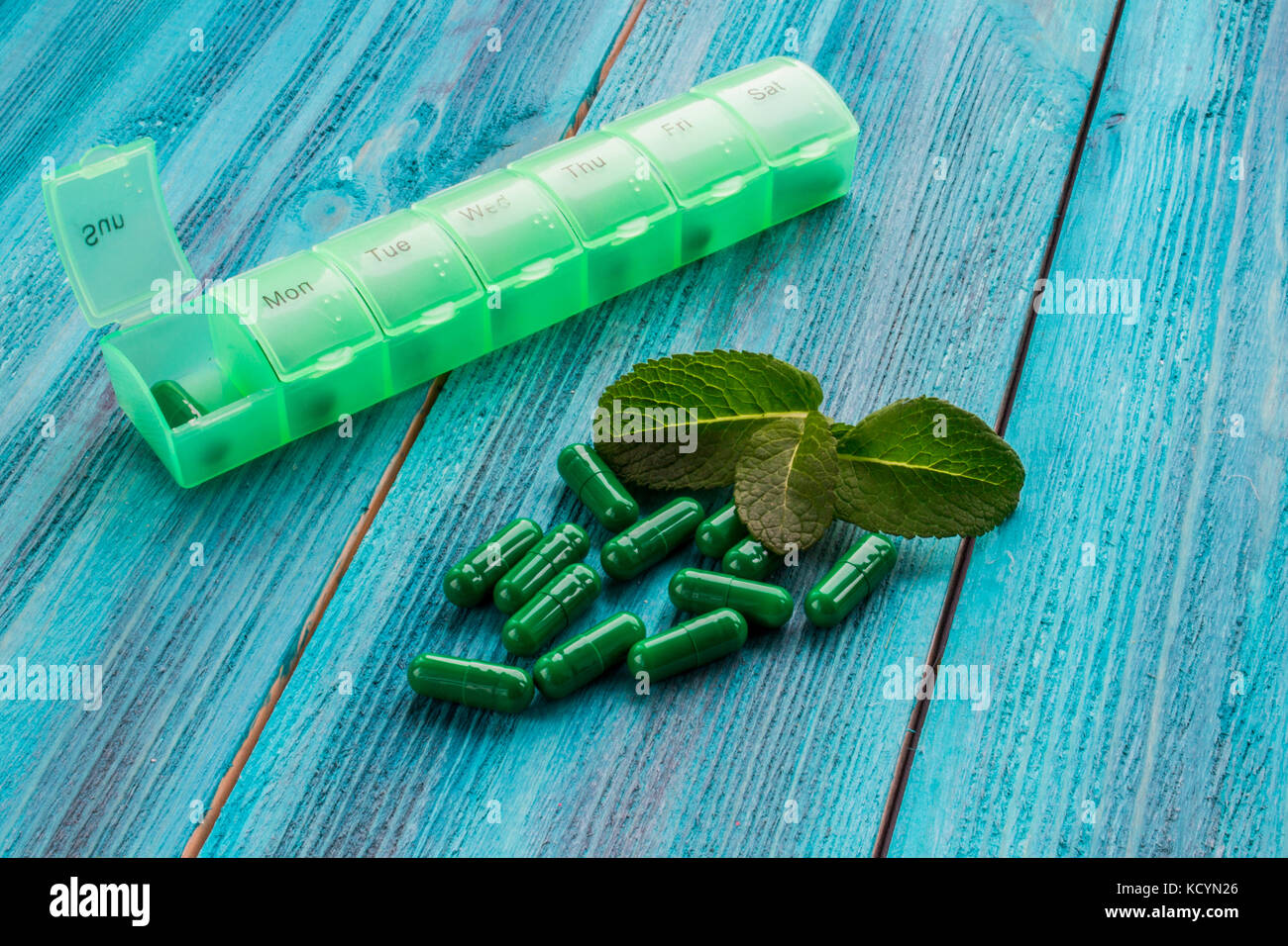 nutritional supplements in capsules on a wooden background Stock Photo ...