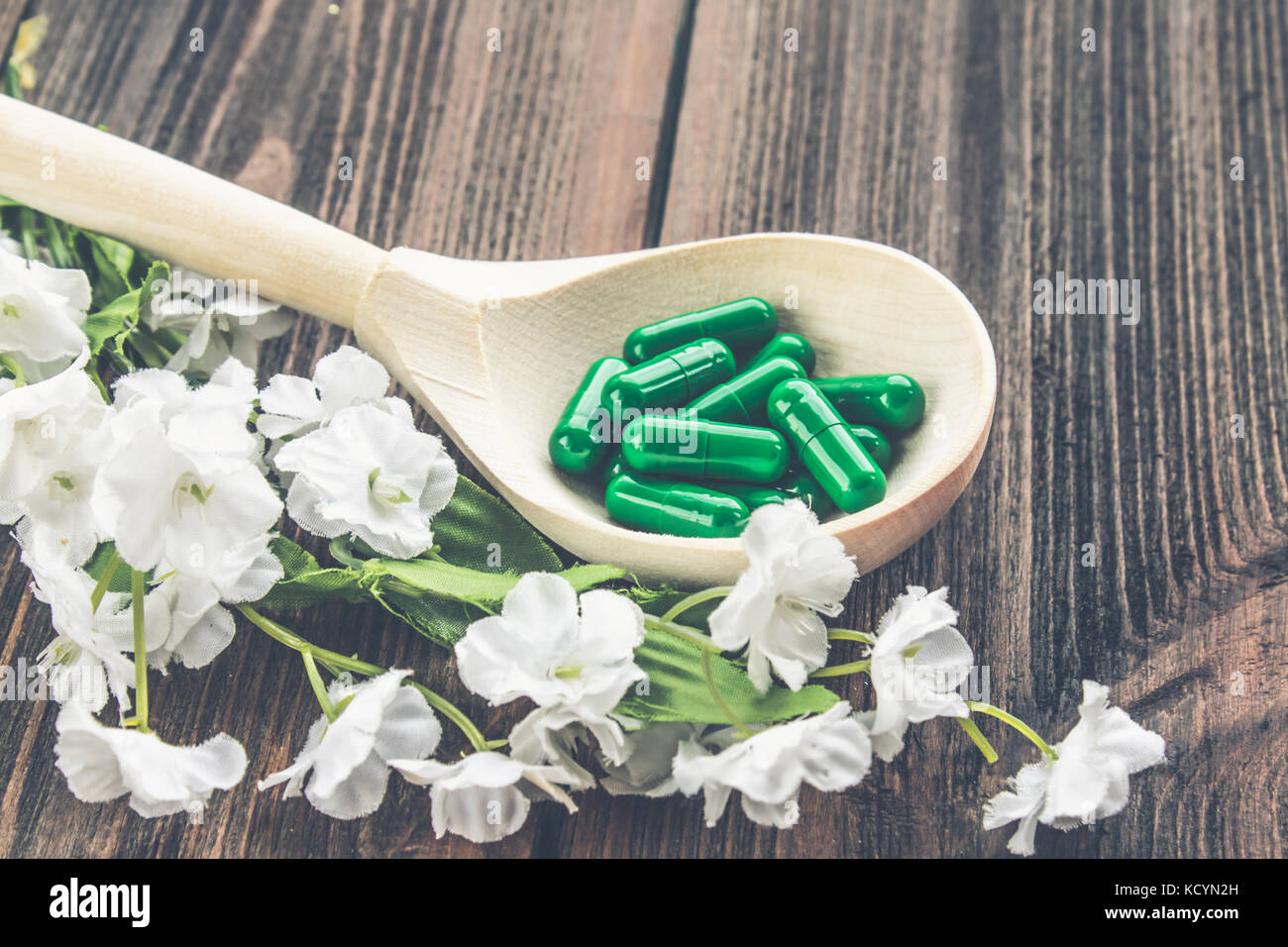 nutritional supplements in capsules on a wooden background Stock Photo ...