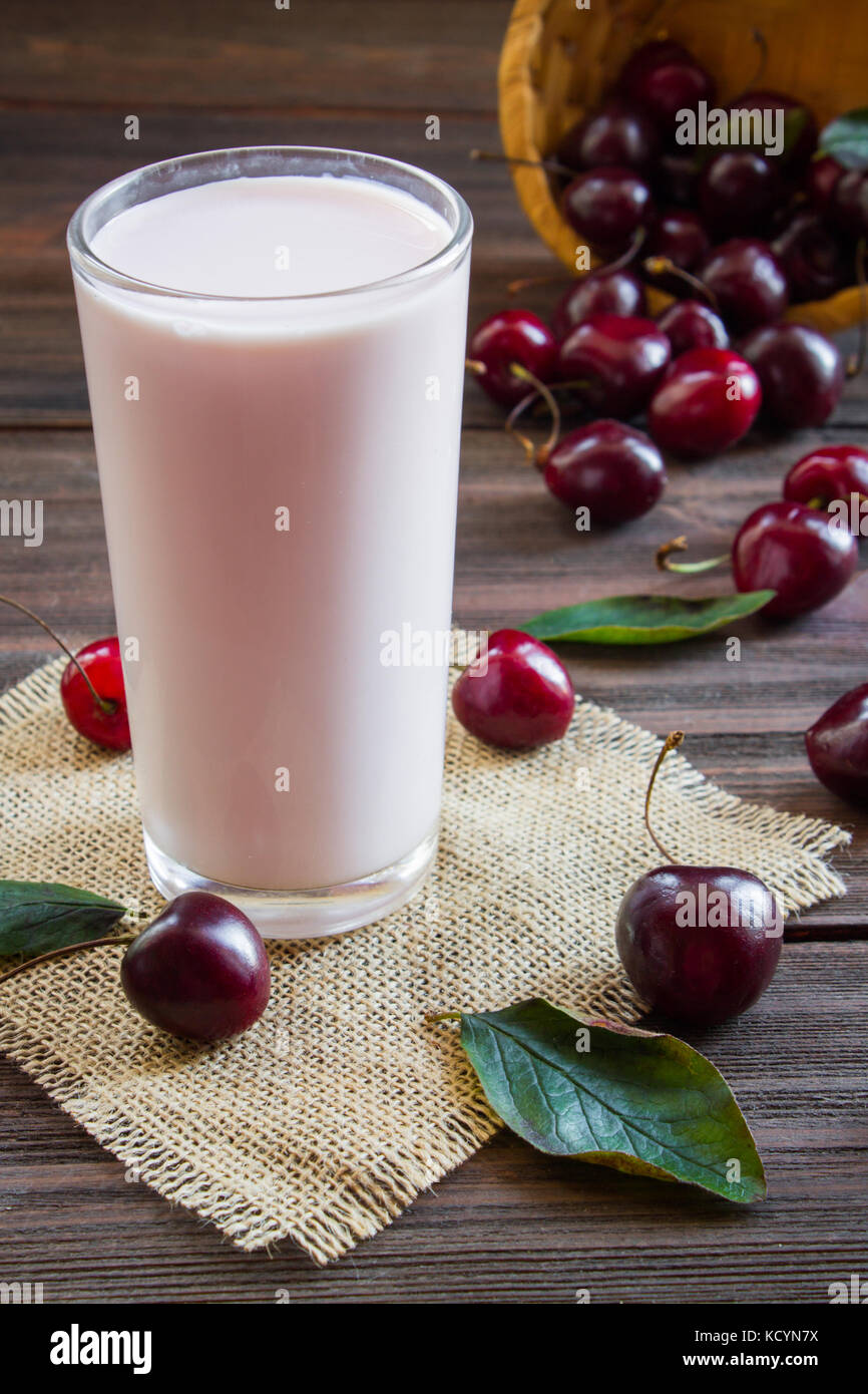 Cherry milk shake. Wooden background Stock Photo - Alamy