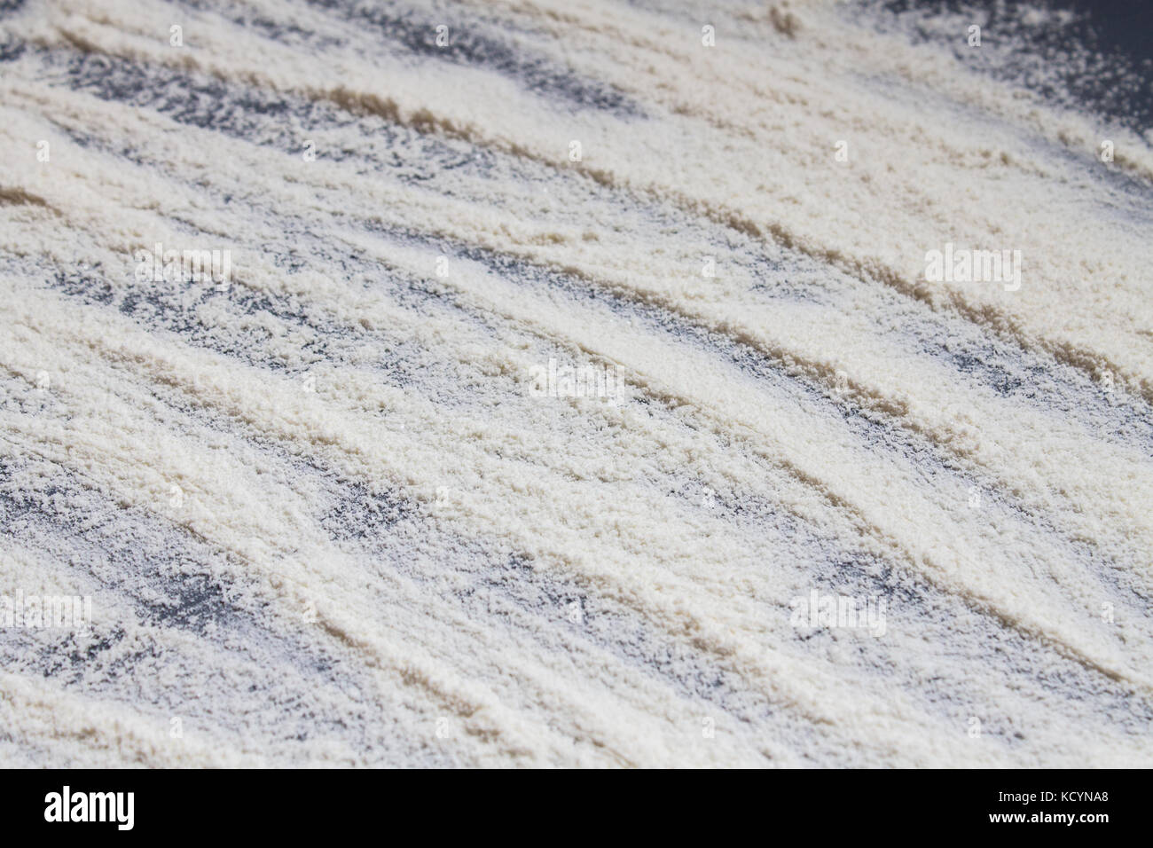 Flour on a black background Stock Photo - Alamy
