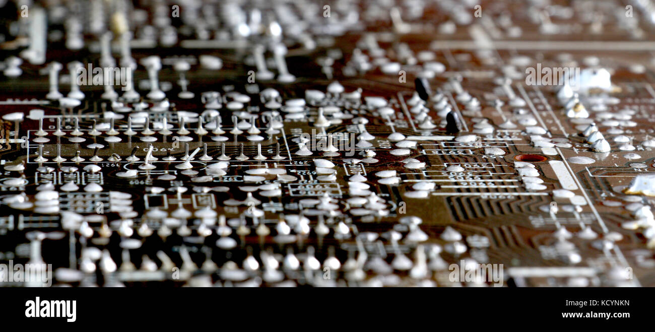 Part of old vintage printed circuit board with electronic components ...