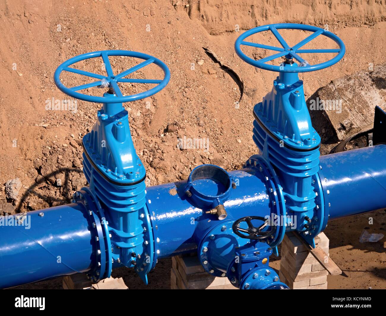 Gate valves underground, water pipeline valve on a blue pipeline after ...
