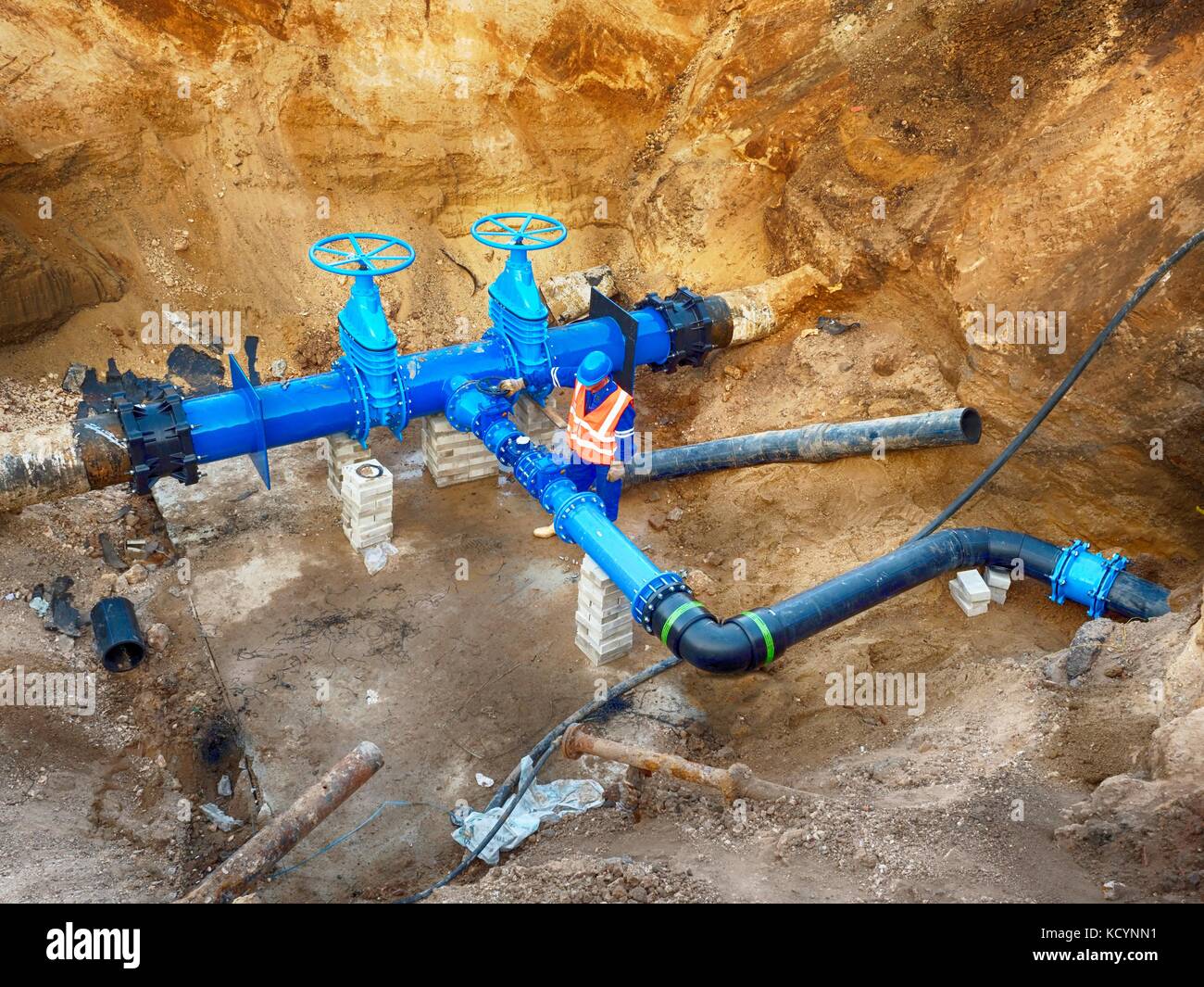 Technical expert underground at gate valve on 500mm drink water pipes ...